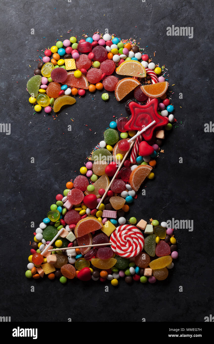 Number two made from sweet candies on dark background. Greeting card ...