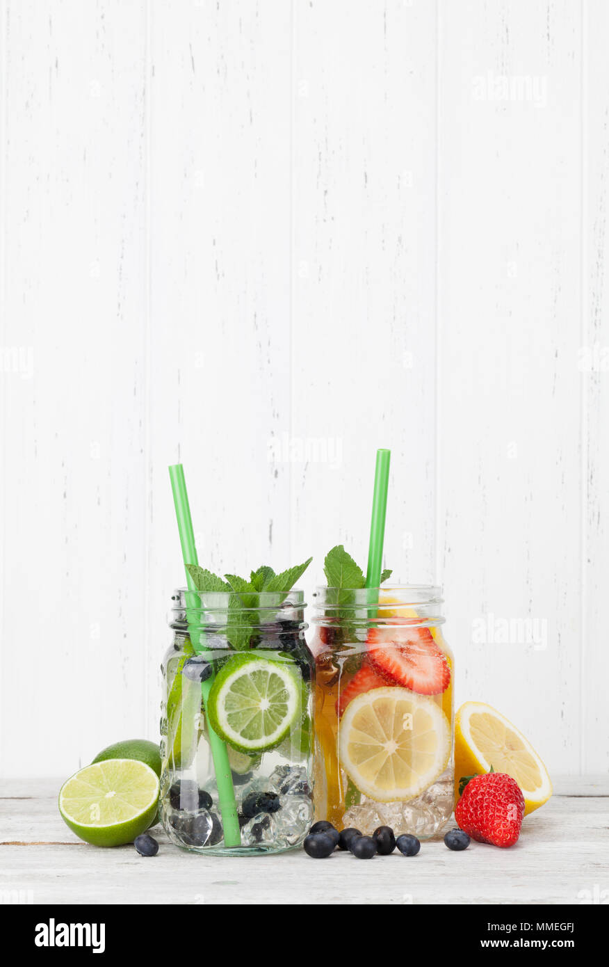 Fresh lemonade jar with summer fruits and berries. With space for your ...