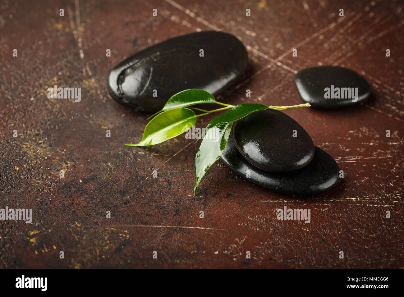 Pile of shiny zen pebble stones with bamboo plant, isolated on white ...