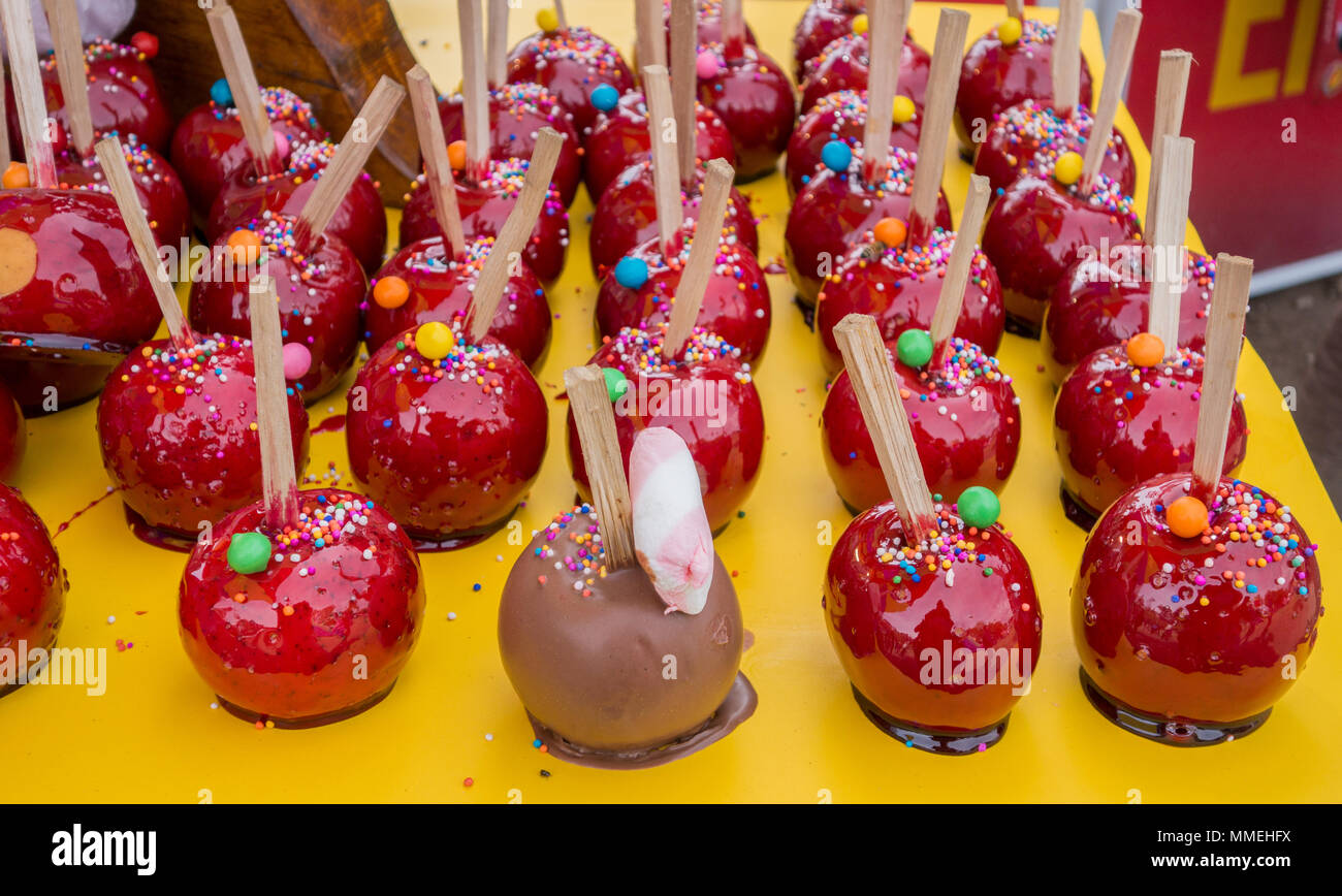 Candied apples on display at street fair Stock Photo - Alamy