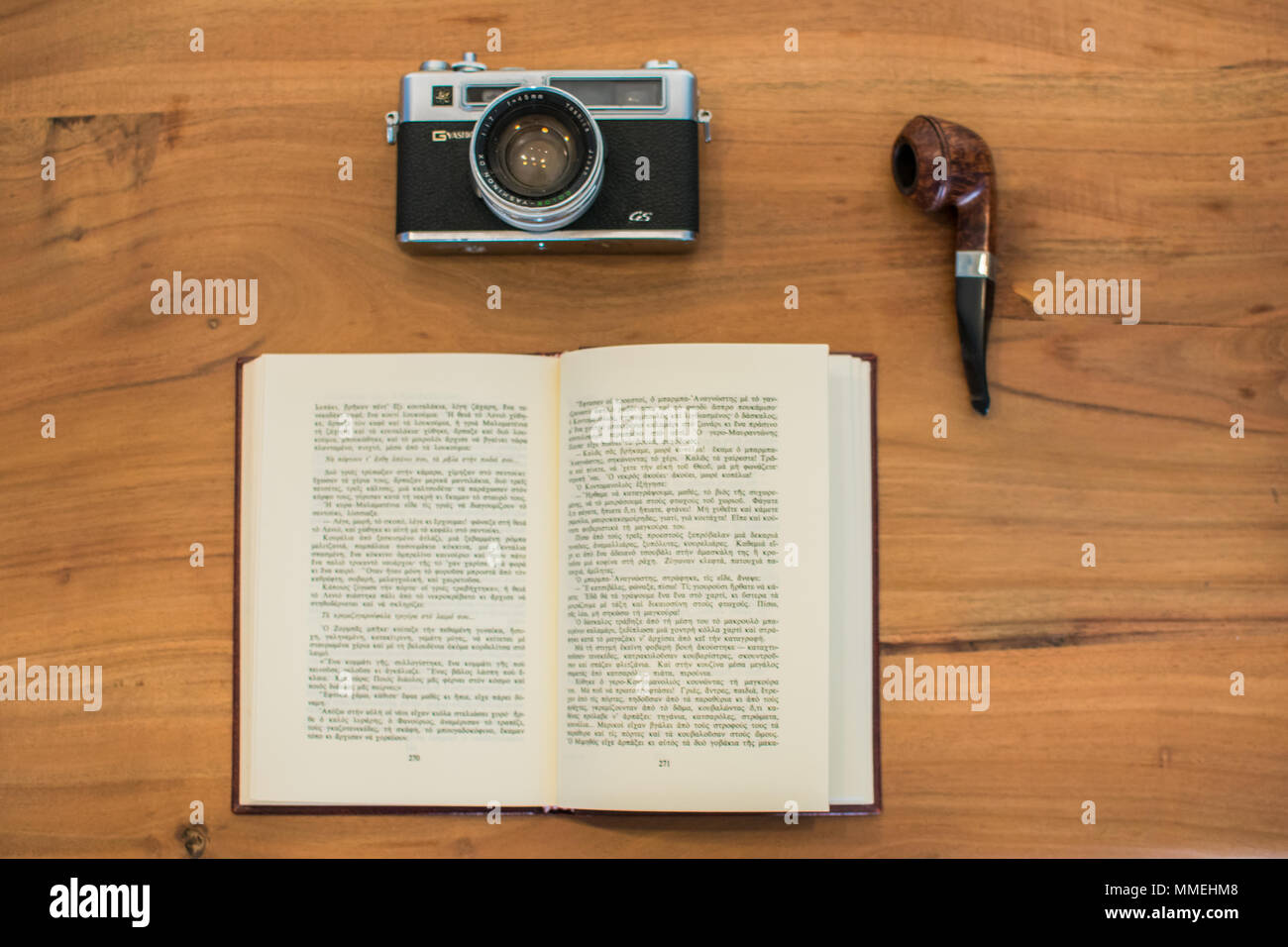 Reading a book and smoking pipe hi-res stock photography and images - Alamy