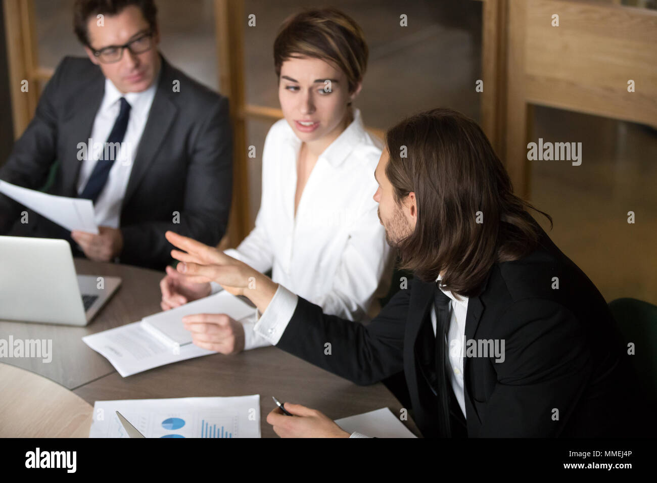 Business executive discussing business team hi-res stock photography ...