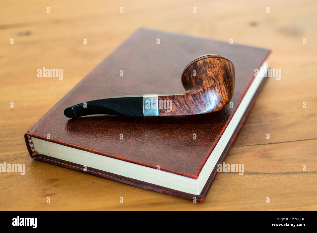 Reading a book and smoking pipe hi-res stock photography and images - Alamy