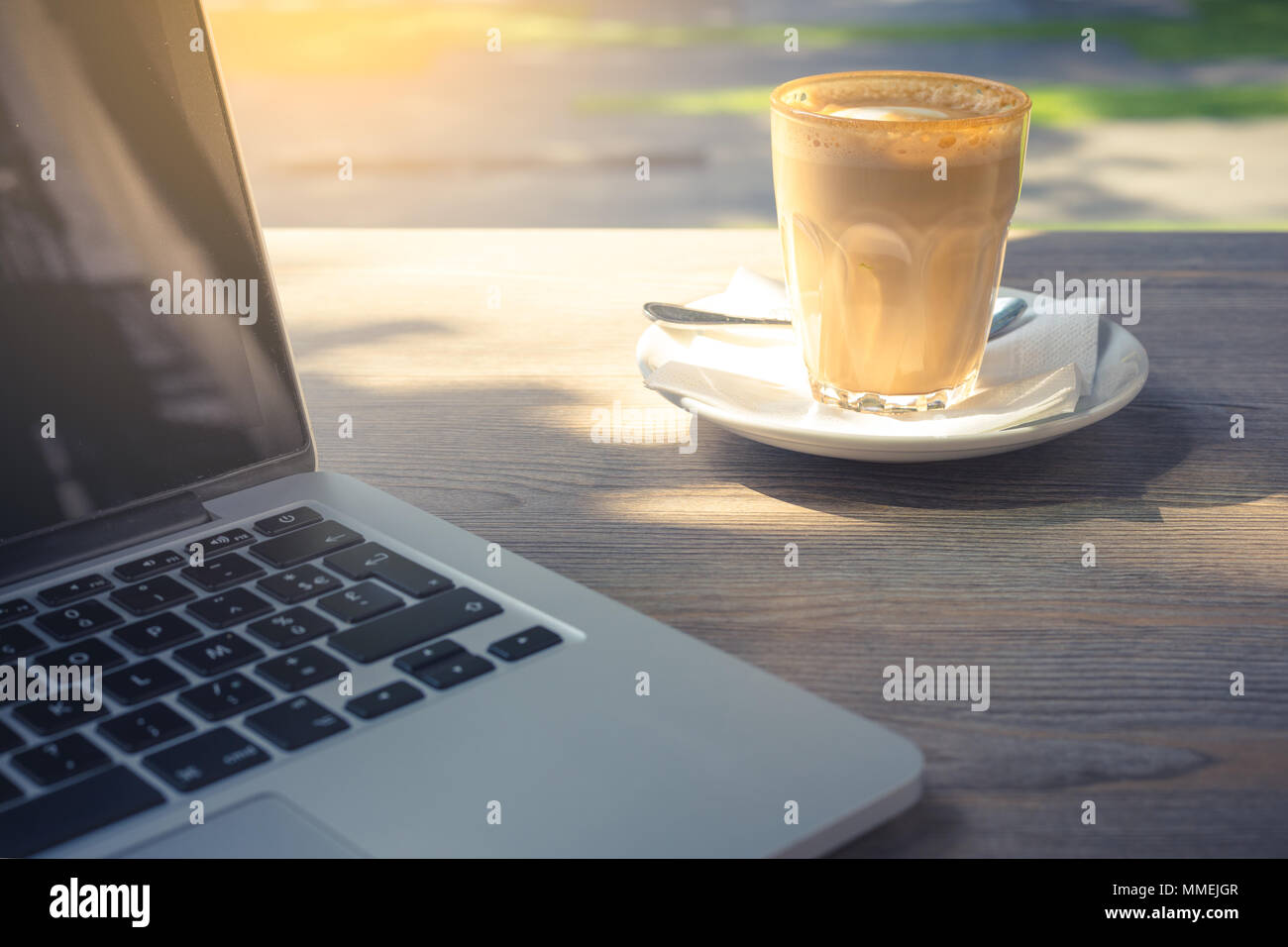 coffee and laptop during a sunny morning Stock Photo - Alamy