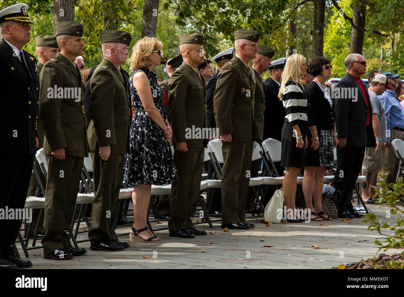 Service members, veterans, and civilians, stand as the Marine Corps ...