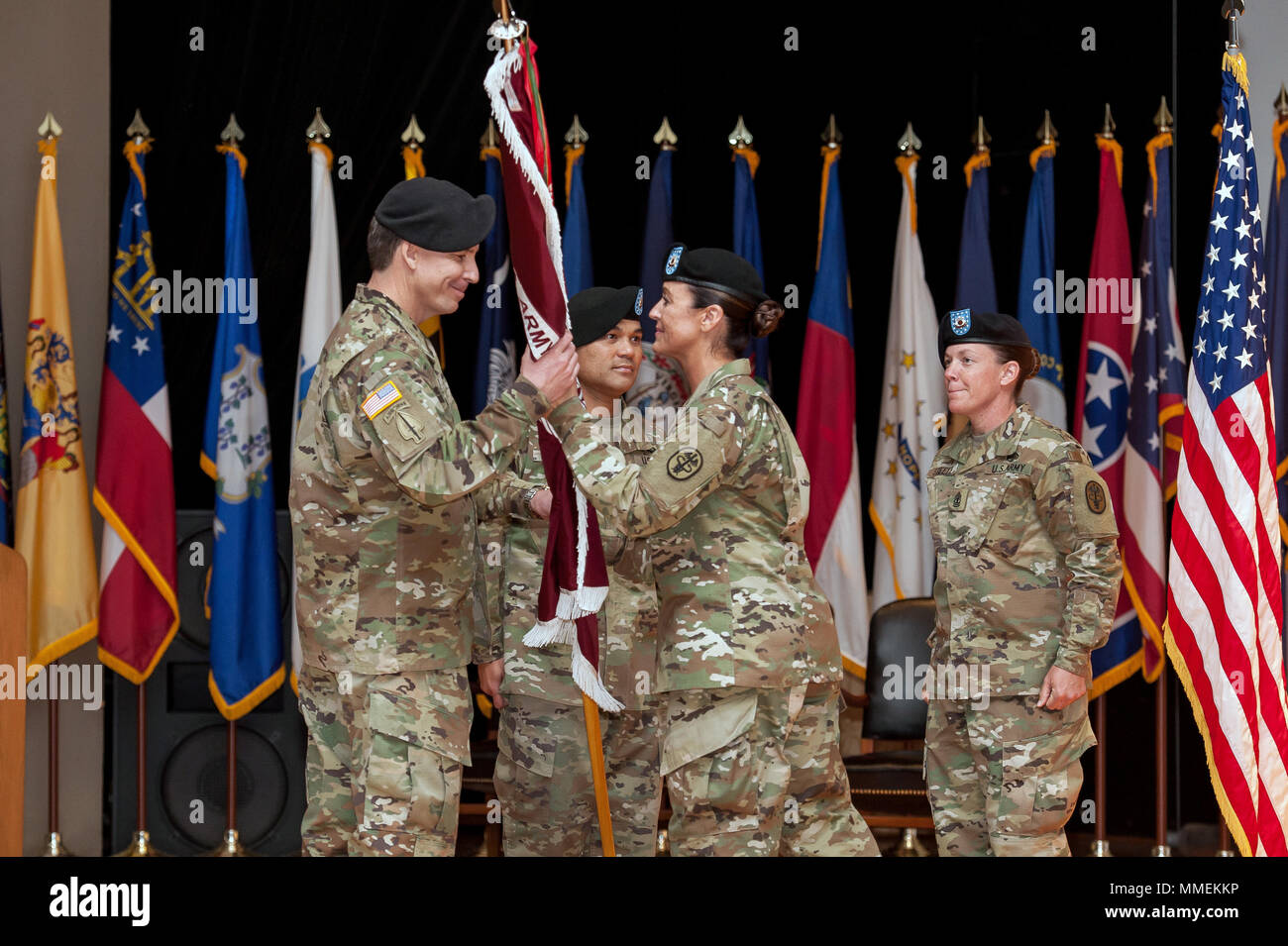 CSM Janell Ray hands the battalion flag to COL Kevin Bass during the ...