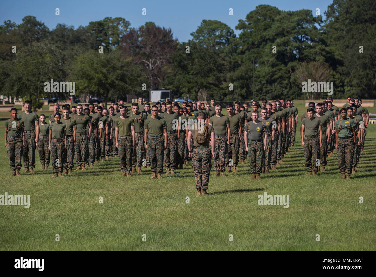 Marines stand in formation during a physical training session aboard ...
