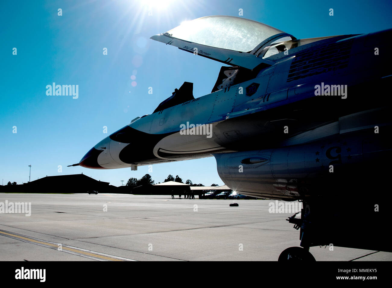 A member of the U.S. Air Force Thunderbirds is parked on a flight line ...