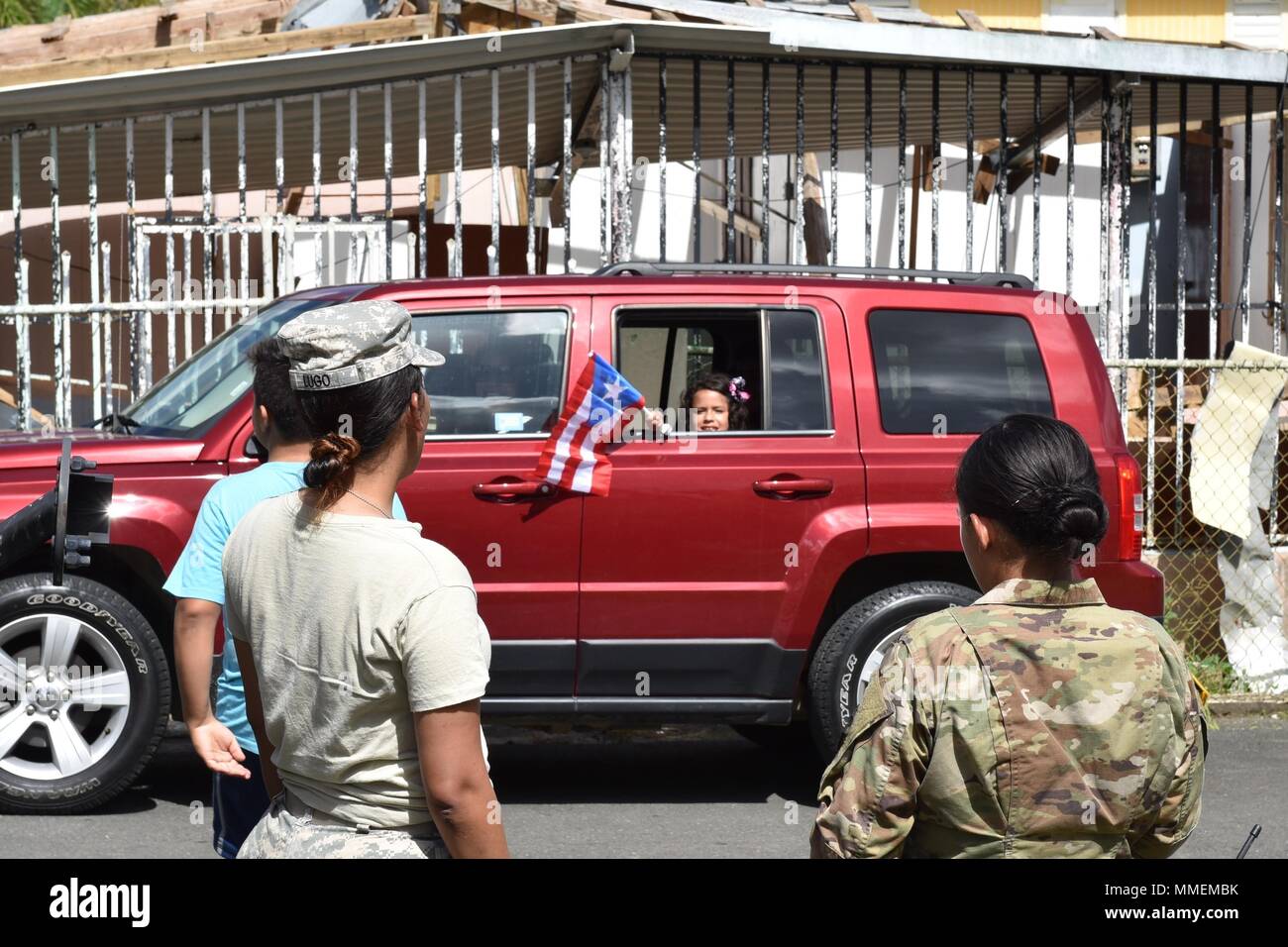 Members of the Army Reserve and Puerto Rico Army National Guard talk to ...