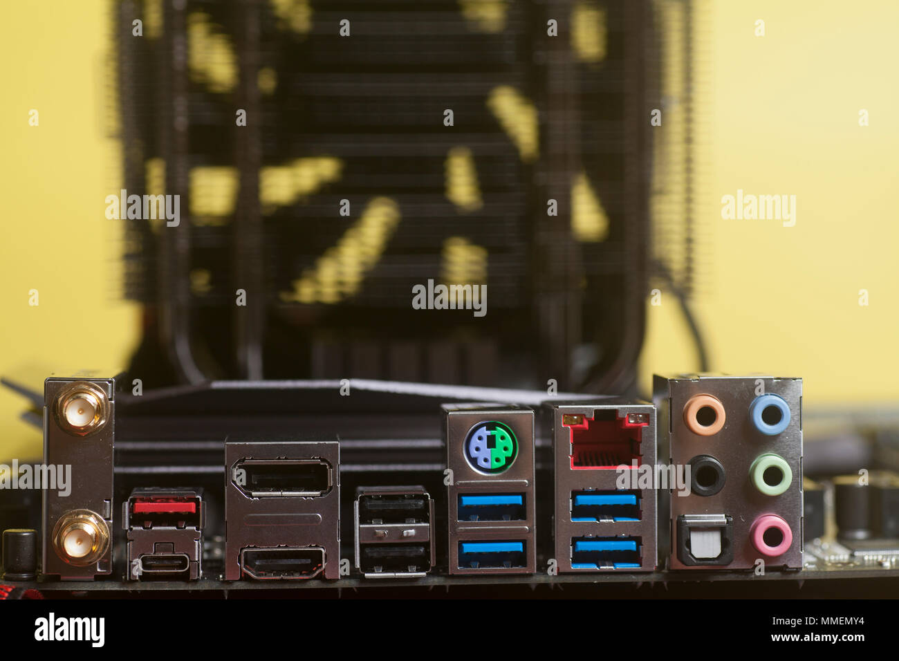Motherboard computer circuit with CPU fan processor cooler on yellow ...
