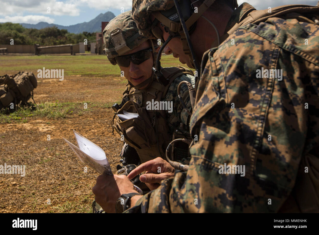 Gunnery Sgt. Dustin Vance (left) speaks with Capt. Josh Horman during a ...