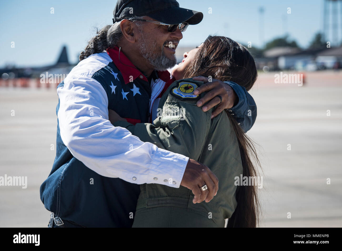 Noelani Mathews, multimedia journalist, hugs her father Ret. Tech. Sgt ...