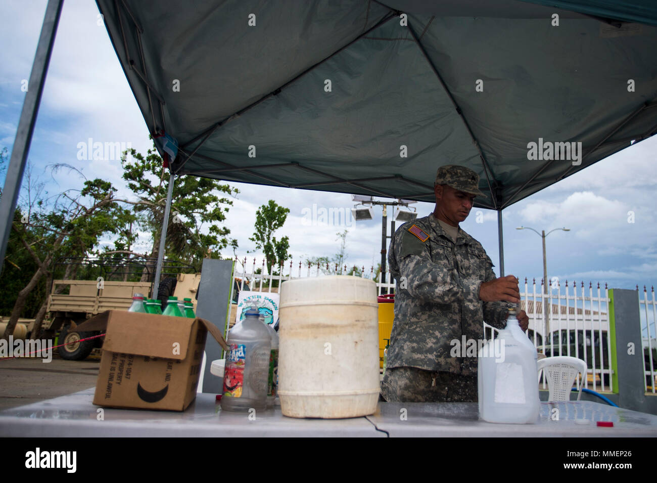 U.S. Army Sgt. Hector Jimenez, water purification specialist, assigned ...