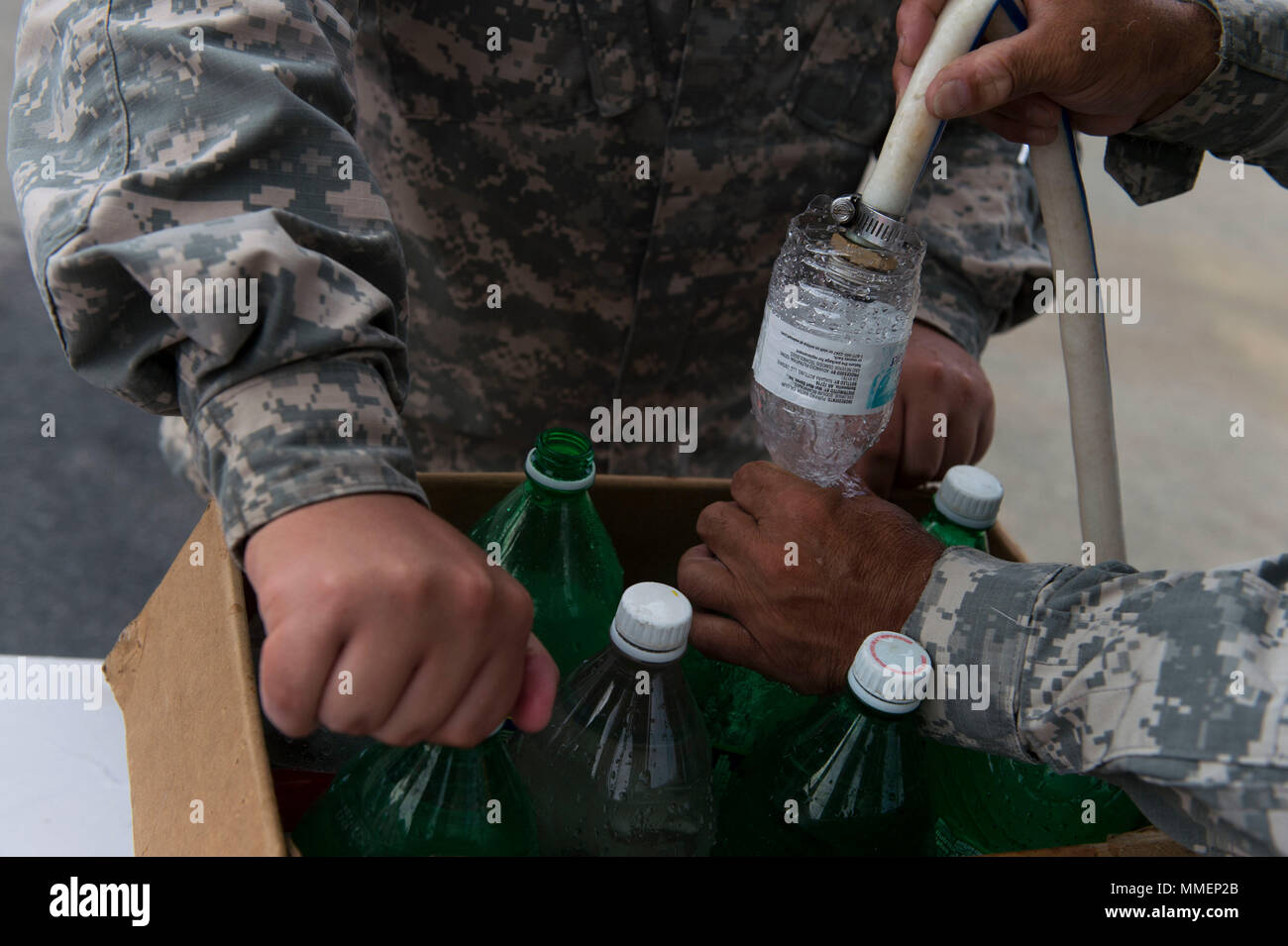 U.S. Army Sgt. Hector Jimenez and Private Julian Vazquez, water ...