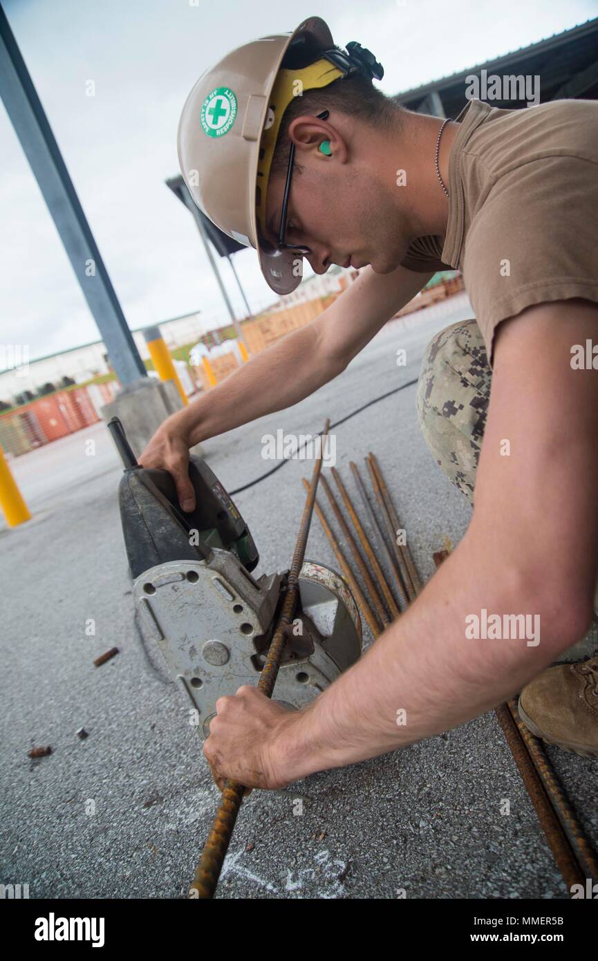 U.S. Navy Steelworker 2nd Class Austin Strope, assigned to Naval Mobile ...
