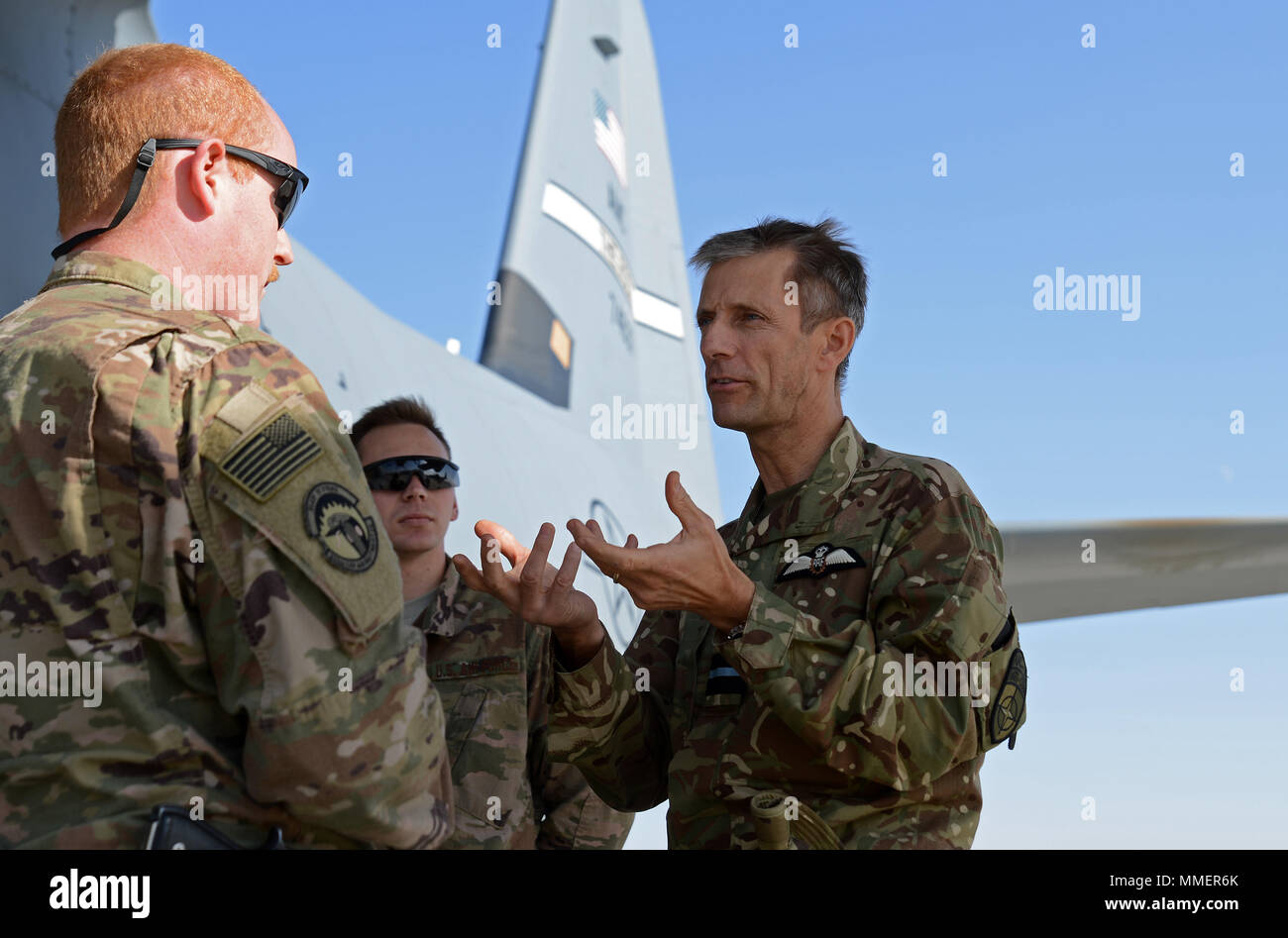 Air Cdre James Hunter, Royal Air Force pilot, speaks with members of ...