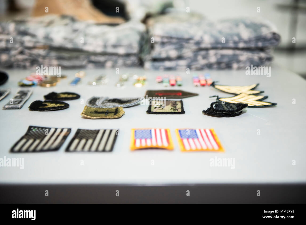 Items belonging to fallen service members are laid out individually so ...