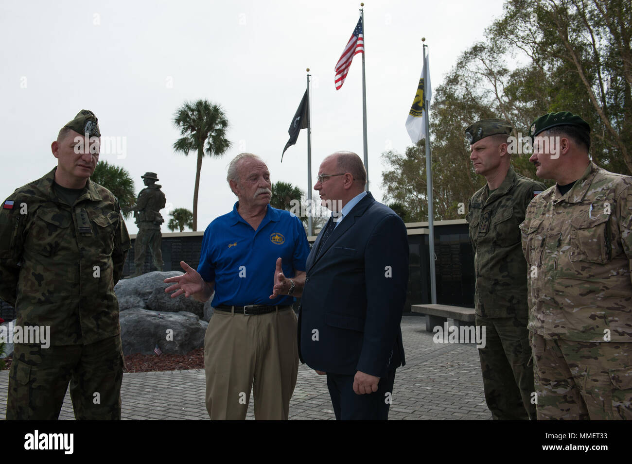 Geoff Barker, center-left, president of the Special Operations Memorial ...