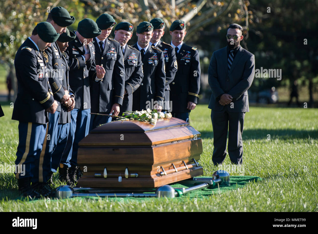 Special Forces soldiers pay condolences during the graveside service of ...