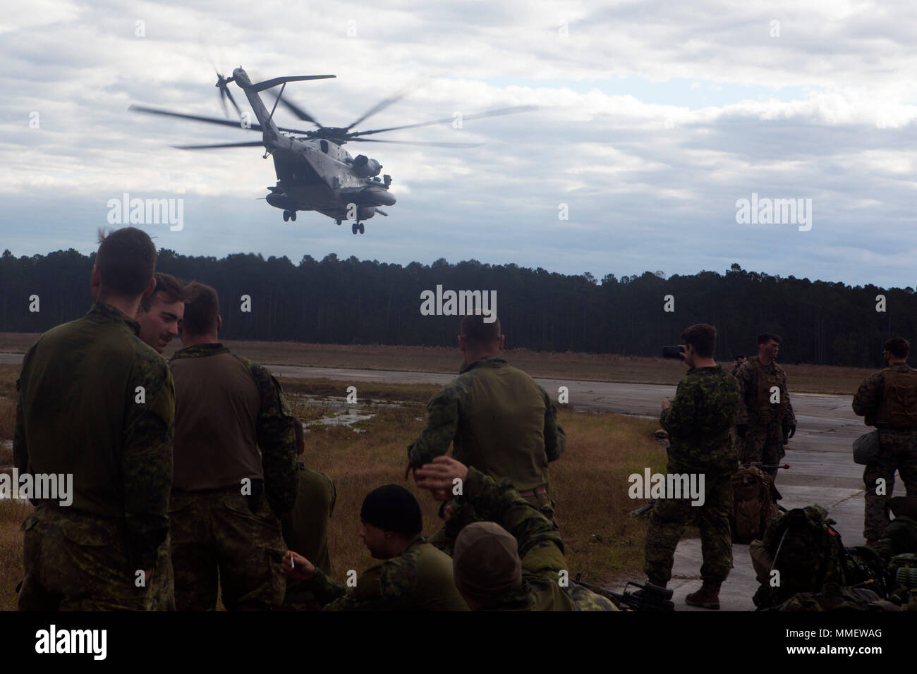 Norwegian Army Soldiers and U.S. Marines watch as a CH-53 Super ...