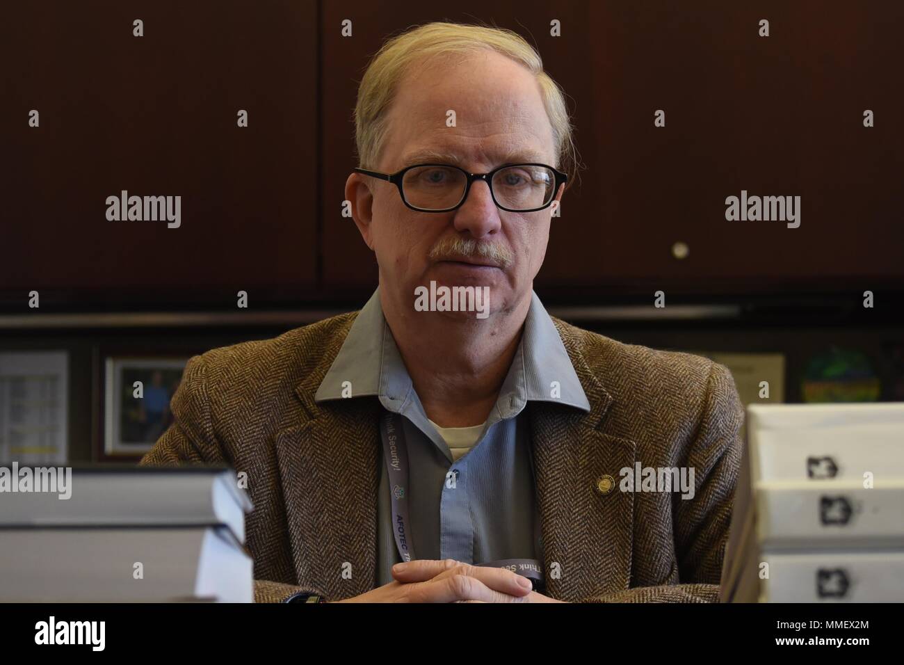 Jim Mesco, 50th Space Wing historian, sits at his office in the 50th SW ...
