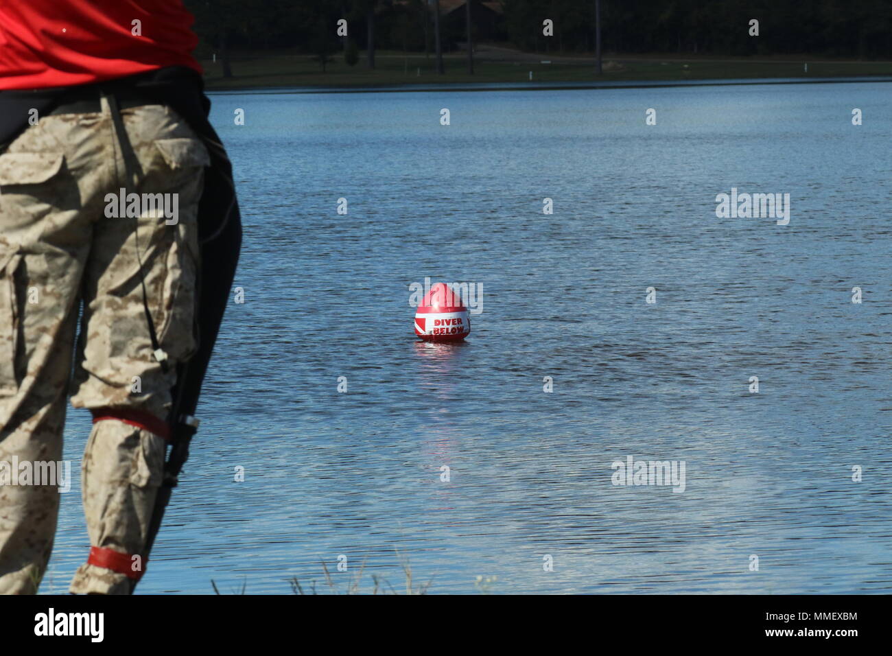 A Diver Below buoy bobs in the water as two groups of divers from 7th ...