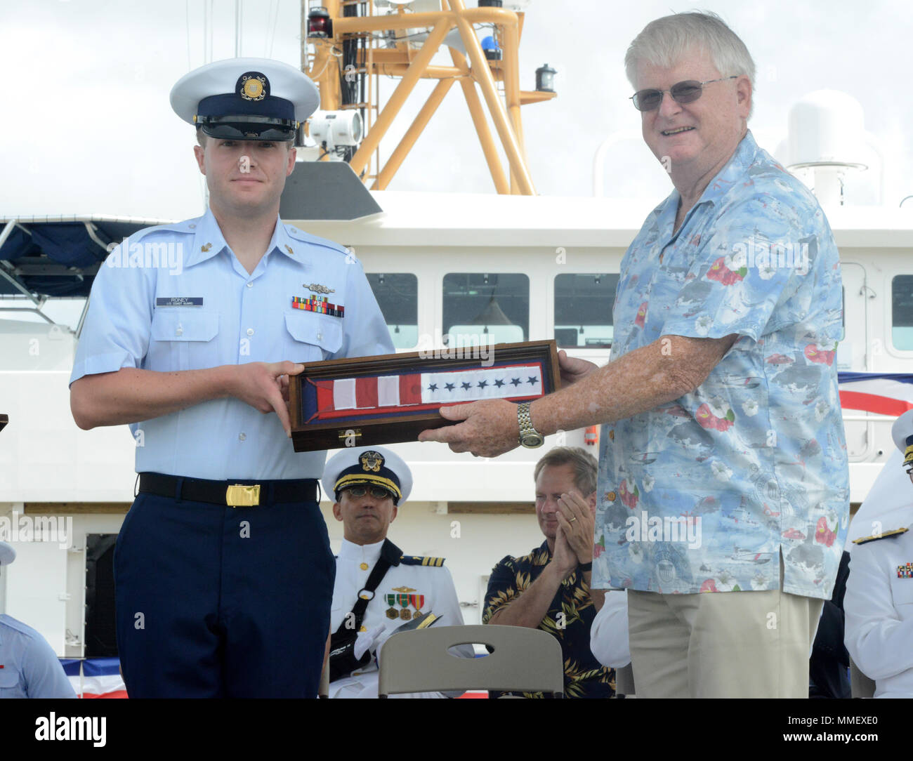 Retired Coast Guard Captain Mont Smith presents the Coast Guard Cutter ...