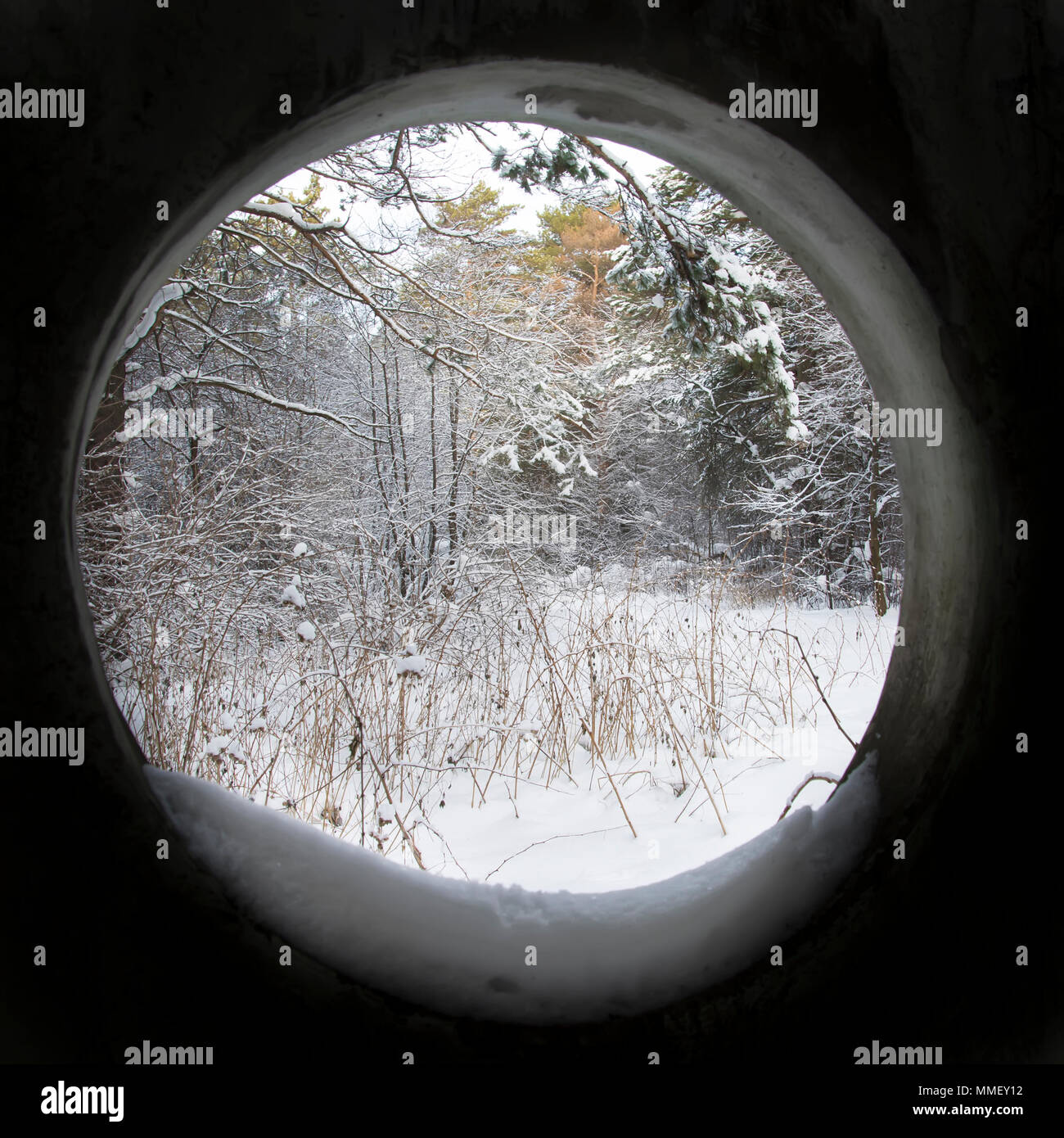 winter landscape through a dark round window with the snow Stock Photo ...