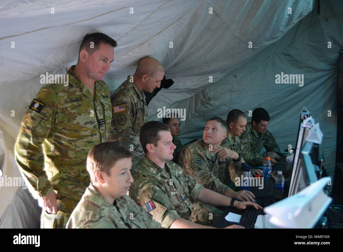 Members of the British, Australian and U.S. military participate in a ...