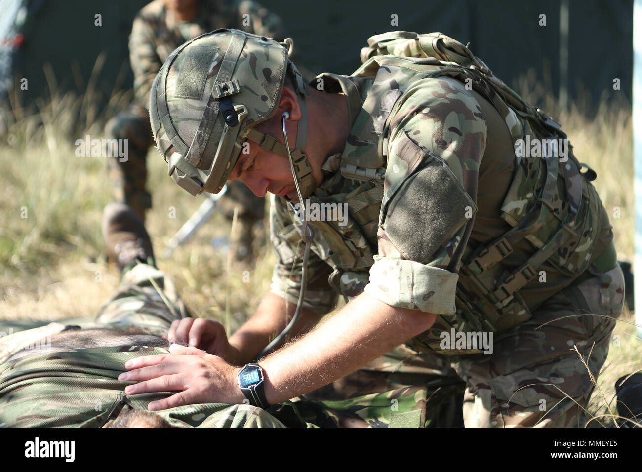 British Royal Navy Petty Officer Medical Assistant Gareth George checks ...