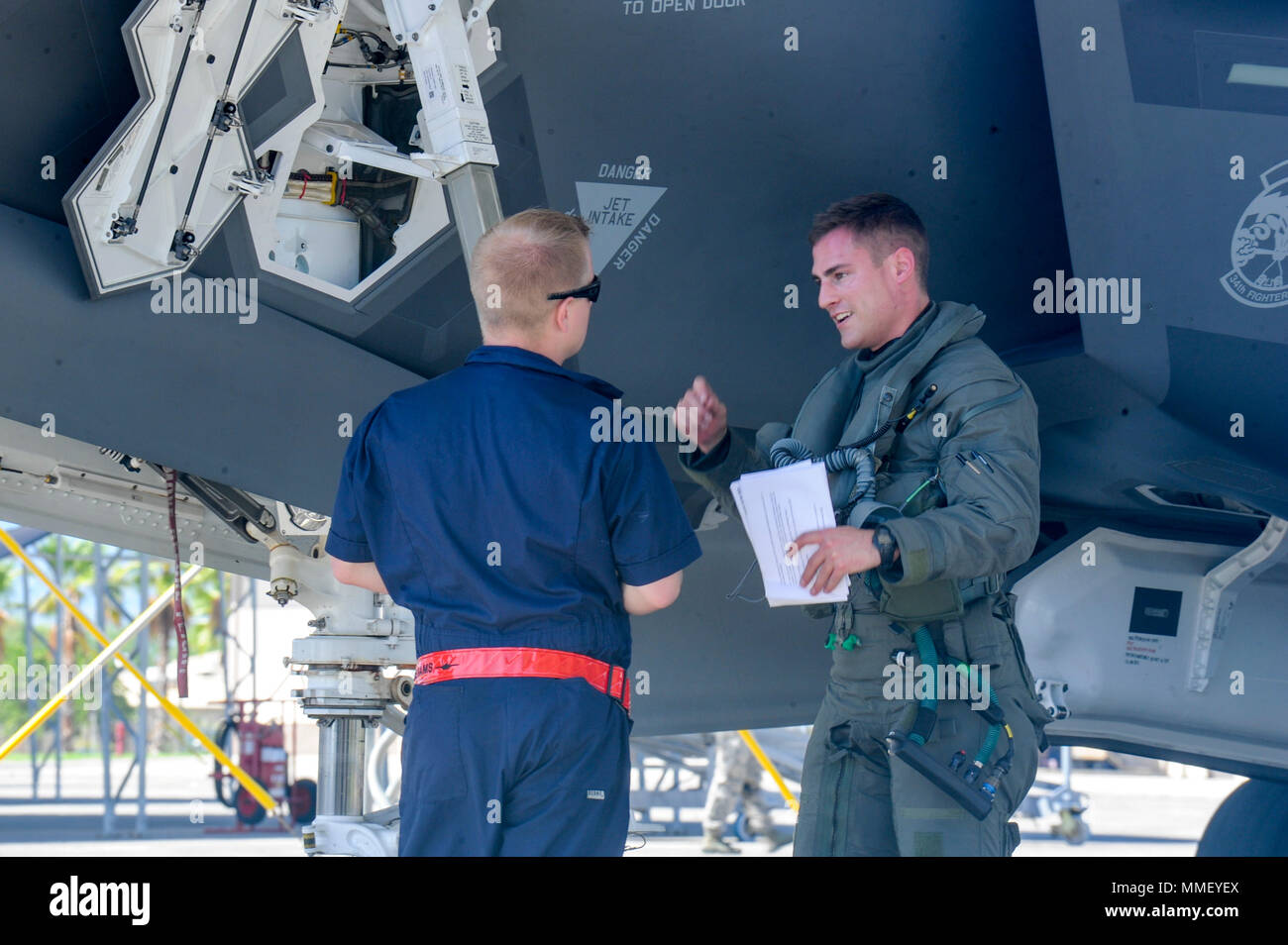 U.S. Air Force 1st Lt. David Moore (right), an F-35A Lightning II pilot ...