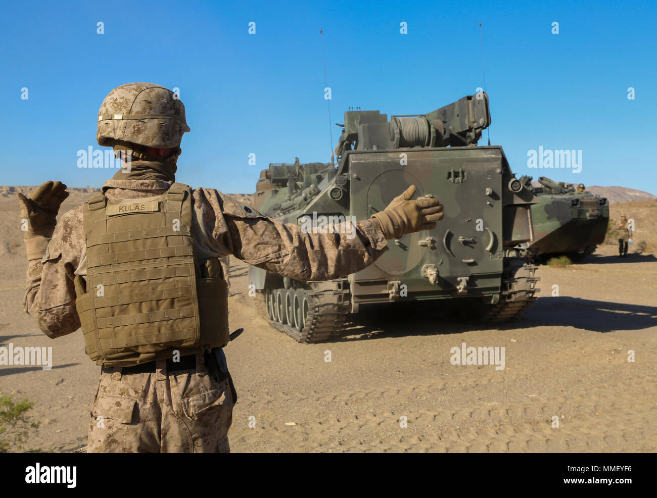 Staff Sgt. Austin Kulas, 3rd Assault Amphibious Battalion, guides the ...