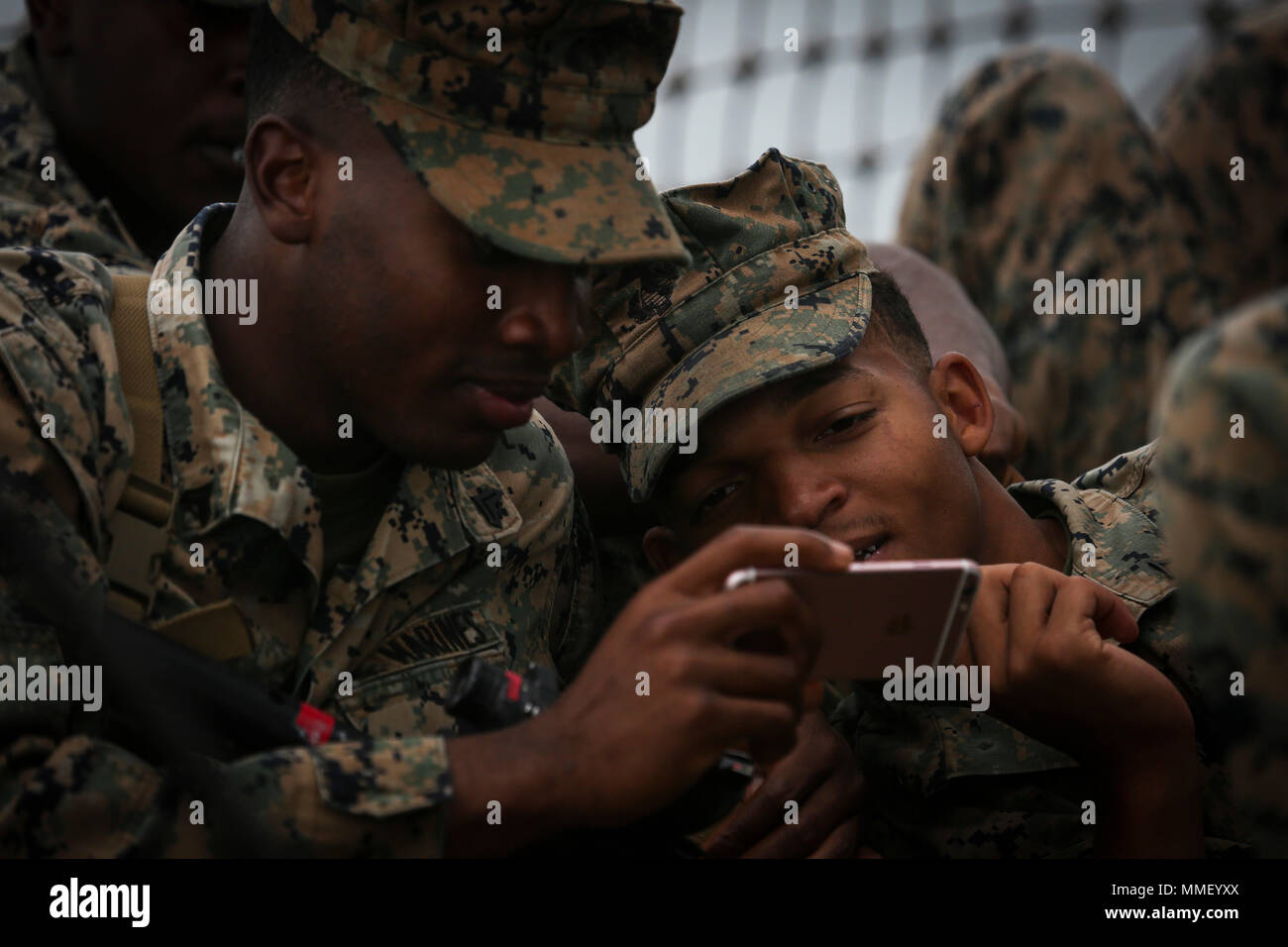 U.S. Marines assigned to 1st Battalion, 3rd Marine Regiment, pass the ...