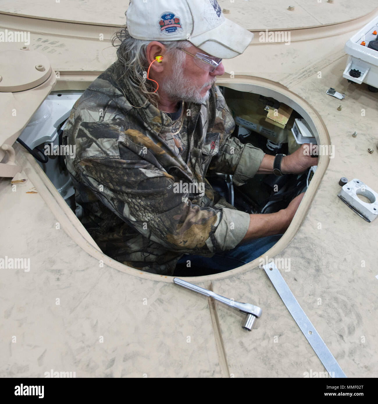 Larry Lackey mounts the rear camera control in the hull of a M1 Abrams ...