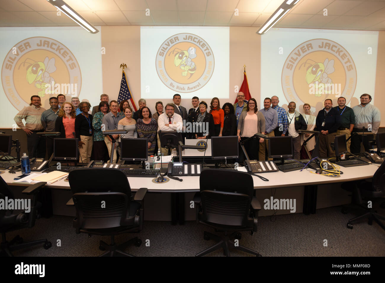 Federal, state and local partners pose for a group photo during the ...