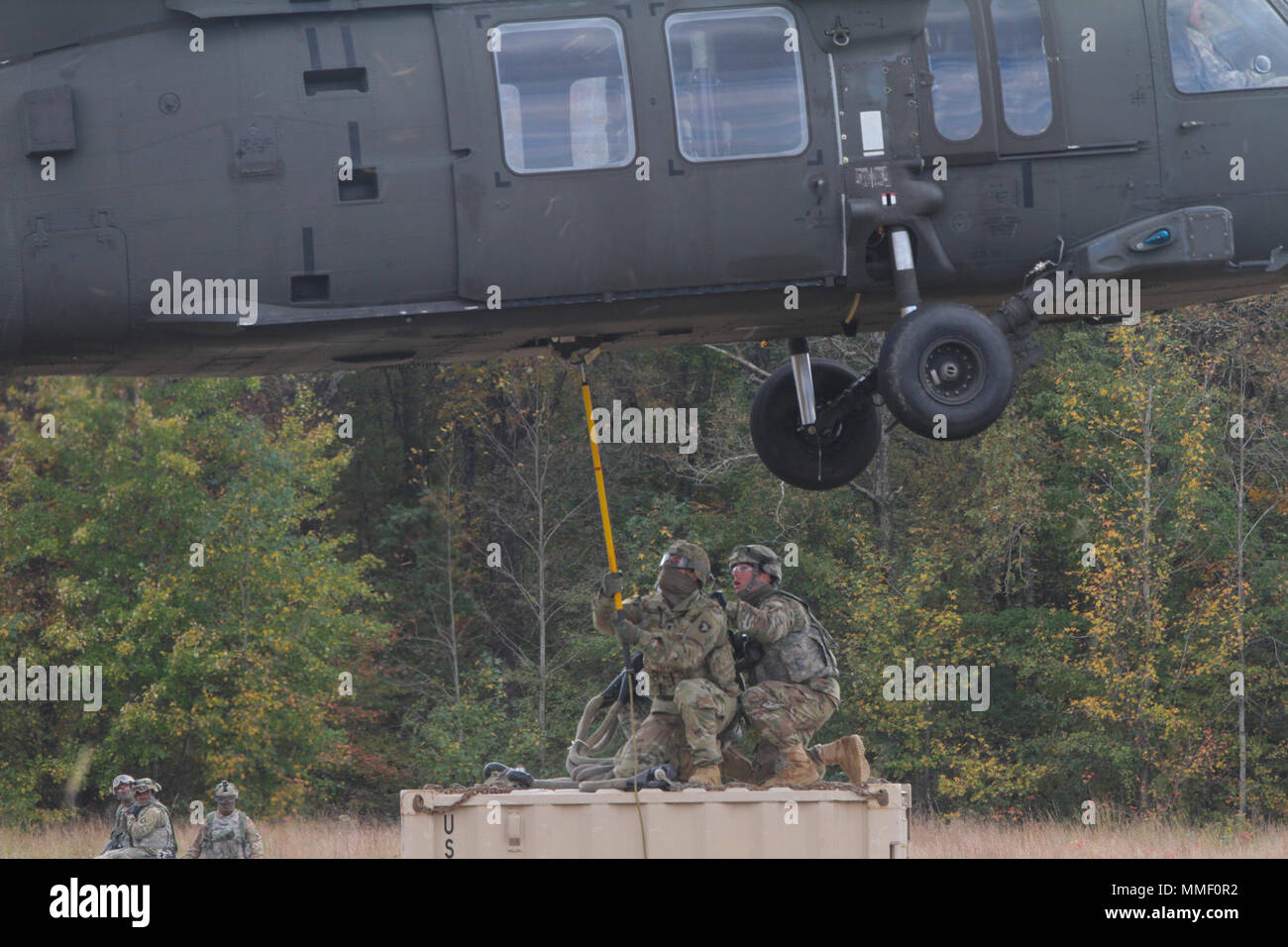 (left to right) Spc. Anthony Addcock and Staff Sgt. Jerry Barnhart from ...