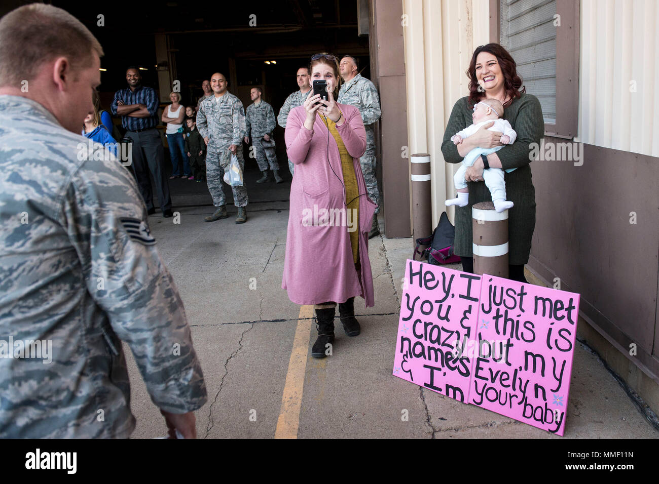 Staff Sgt. Derek Schmidt, 729th Air Control Squadron, is greeted by his ...