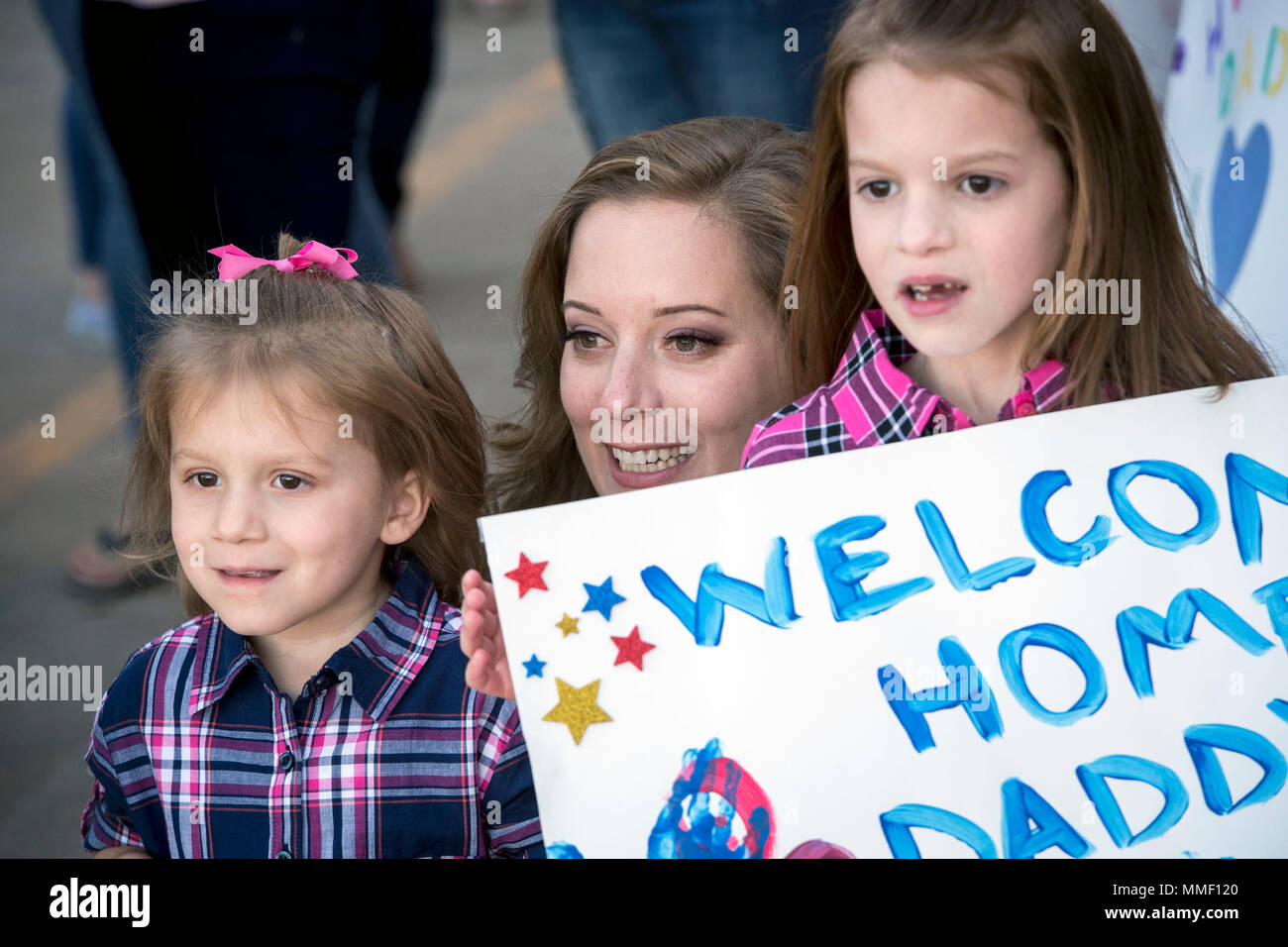 From the left, Carolin, Andrea, and Allison Hewitt await the arrival of ...