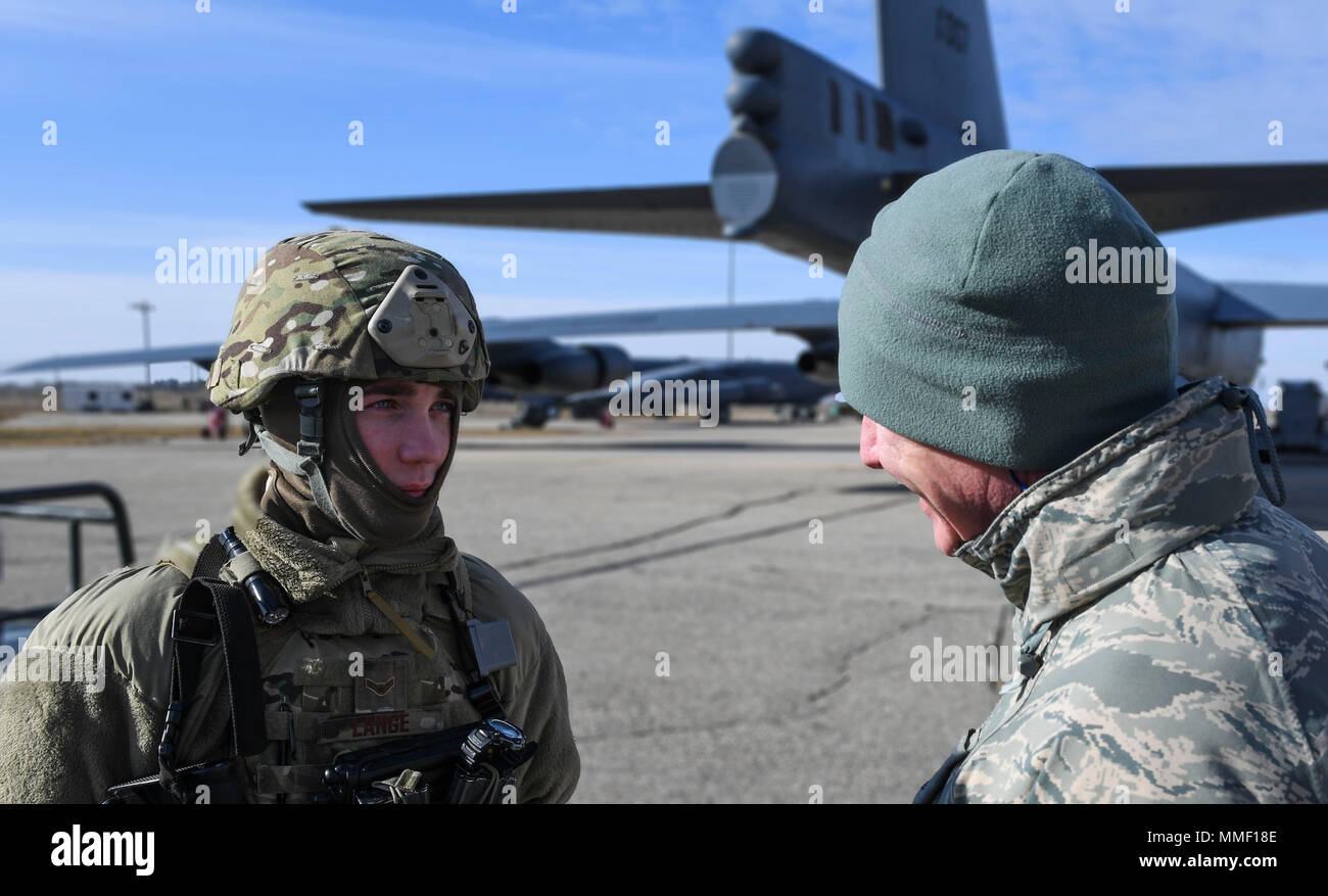 From left, Airman 1st Class Trevor Lange, 5th Security Forces Squadron ...