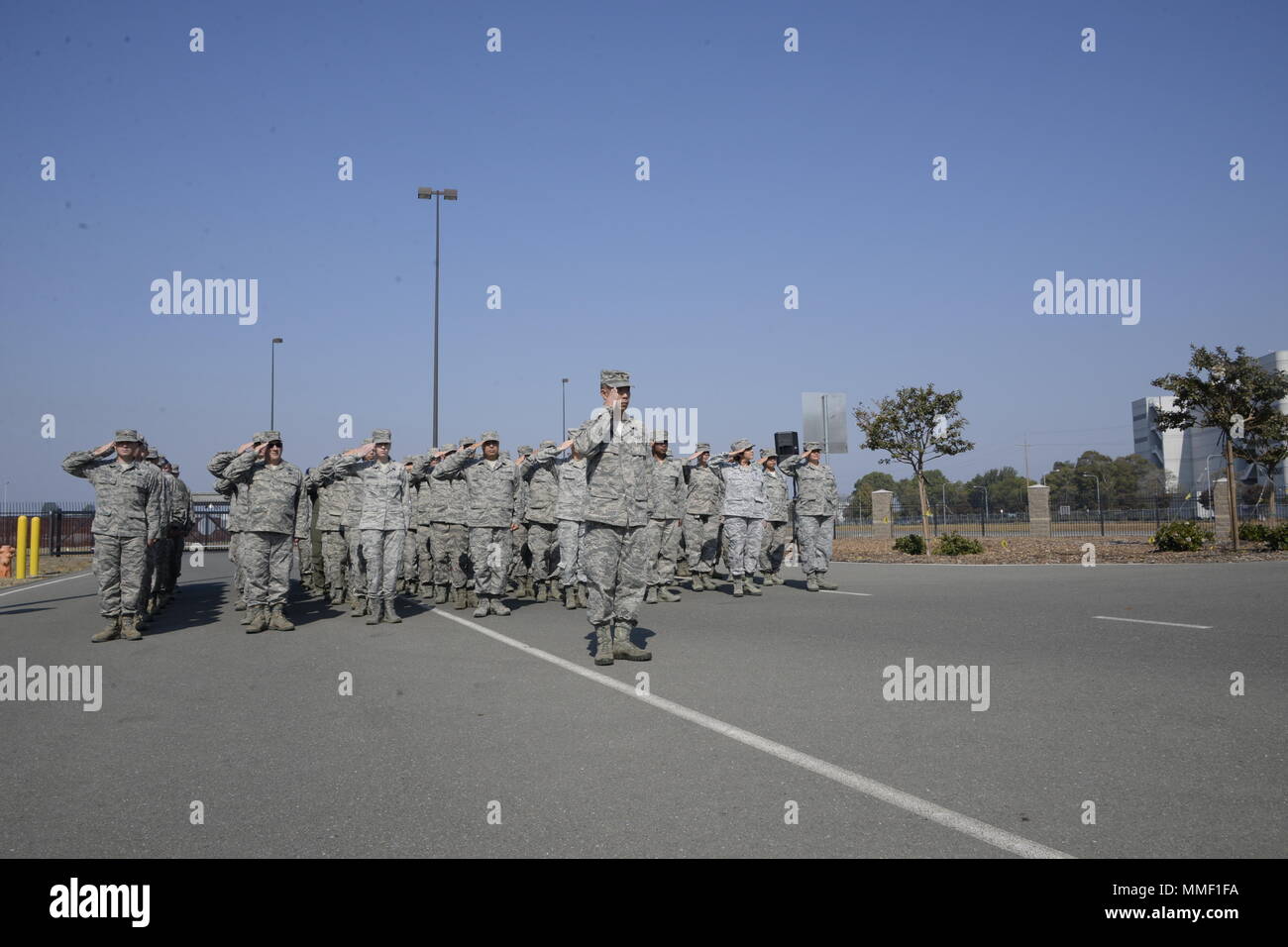 U.S. Airmen from the 129th Rescue Wing renders a salute during the ...