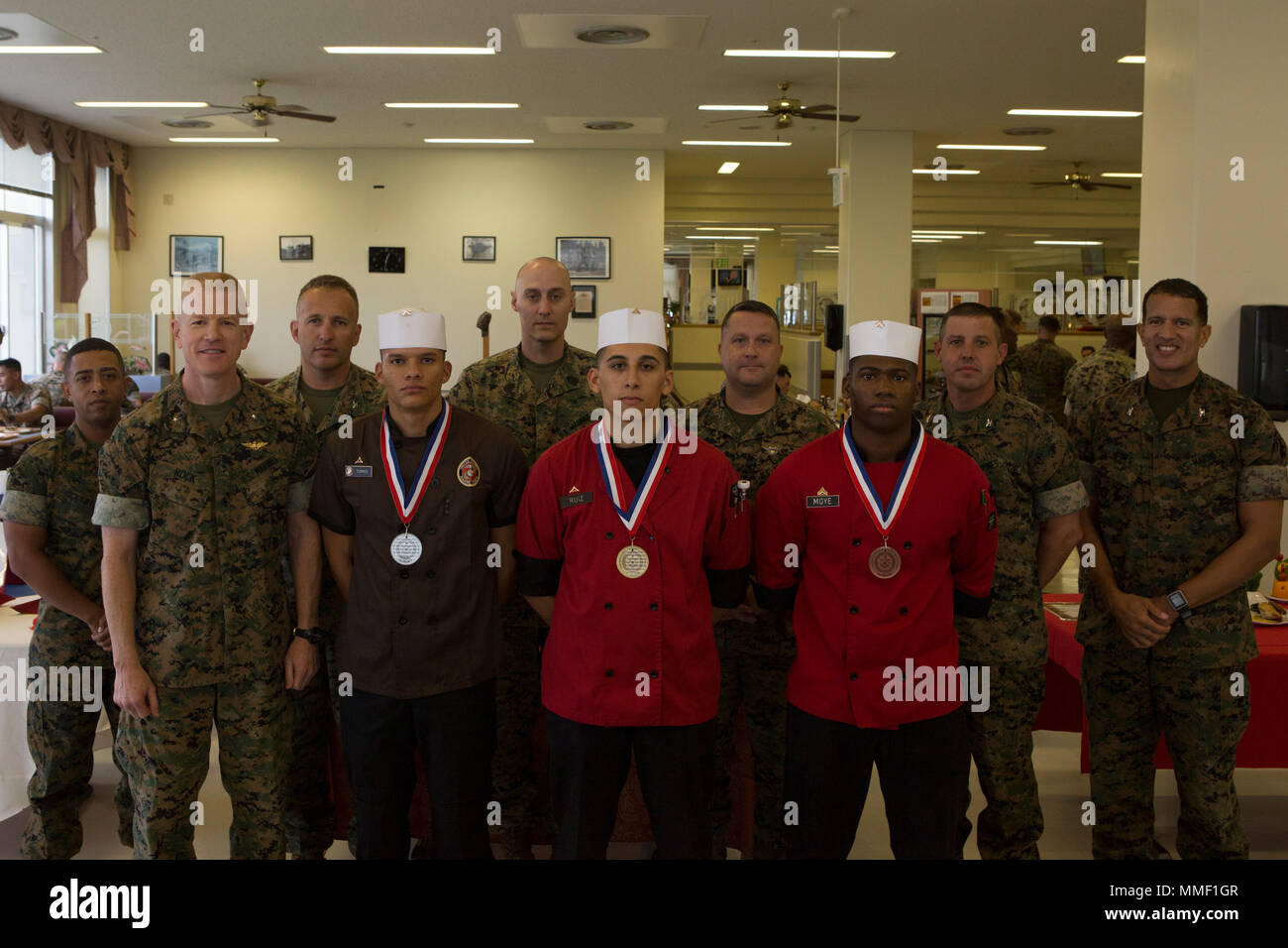 CAMP HANSEN, OKINAWA, Japan— Judges and competitors pose after a Food ...