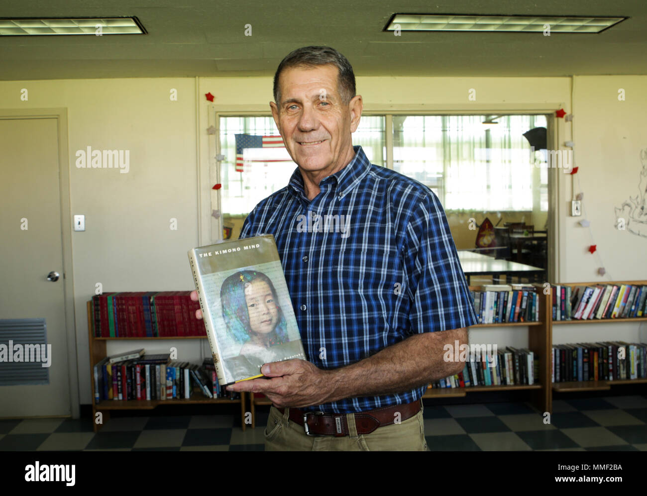 Retired U.S. Marine Corps Willis "Bill" Hansen returns his library book ...