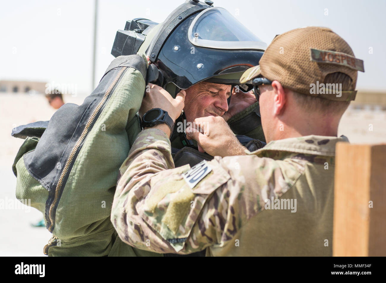 U.S. Air Force Staff Sgt. Brian Vosper (right), explosive ordnance technician assigned to the ...