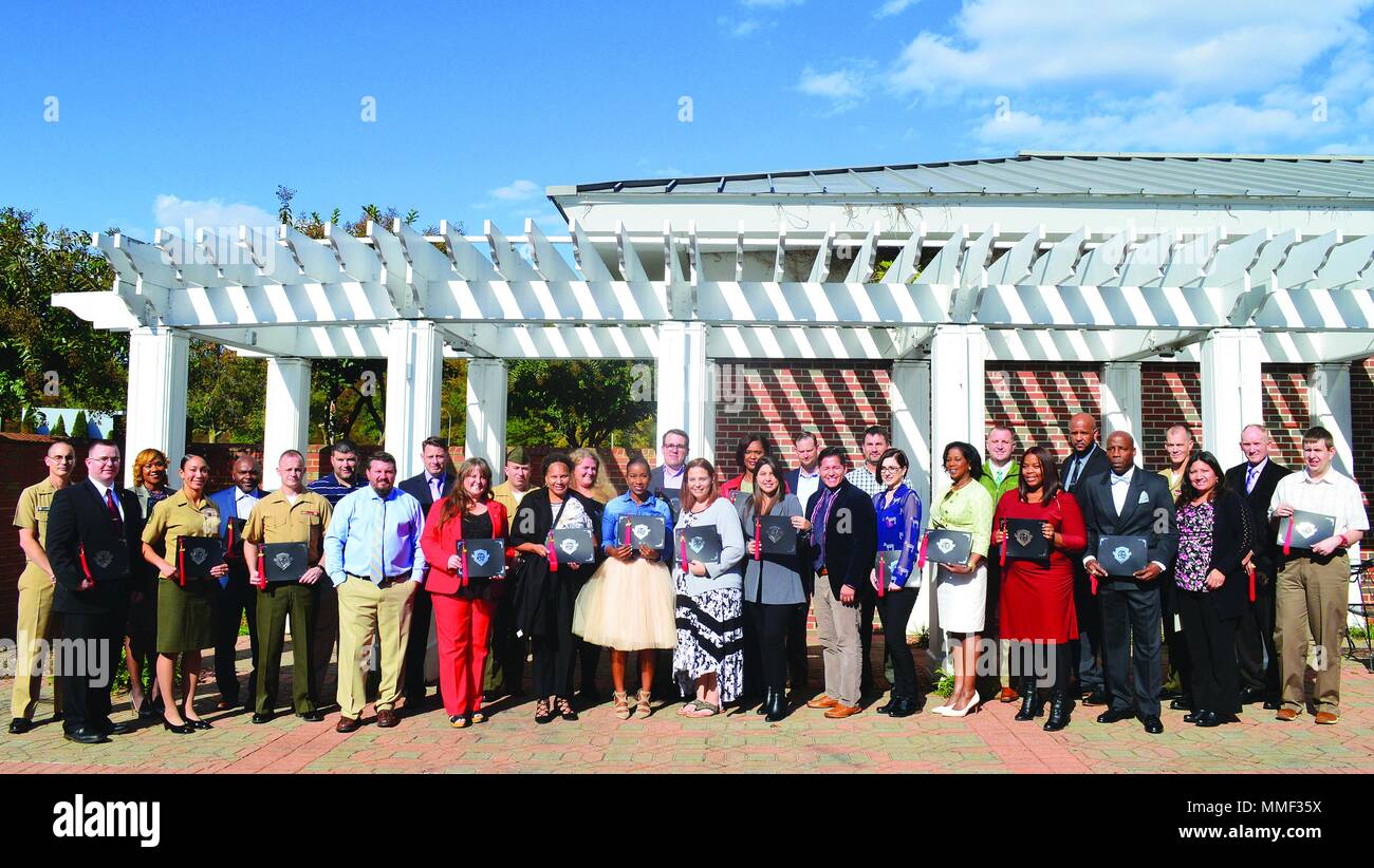 College graduates gather outside of The Clubs at Quantico to take their ...