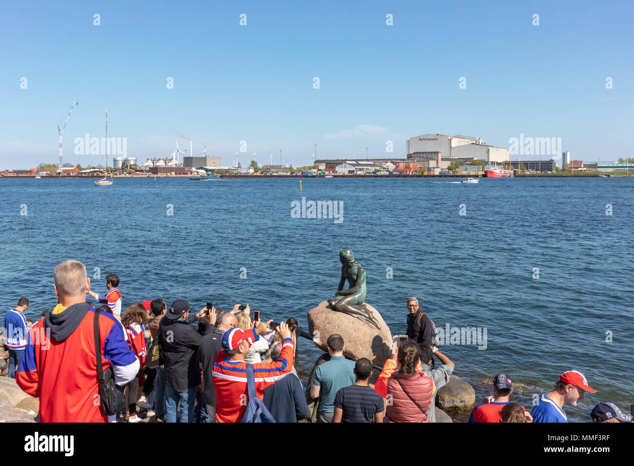 Tourists by The Little Mermaid (bronze statue by Edvard Eriksen, 1913), Copenhagen, Denmark ...