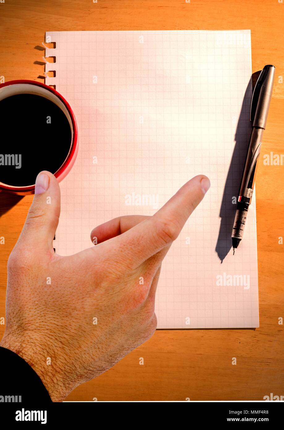 sheet of paper and hand Stock Photo - Alamy