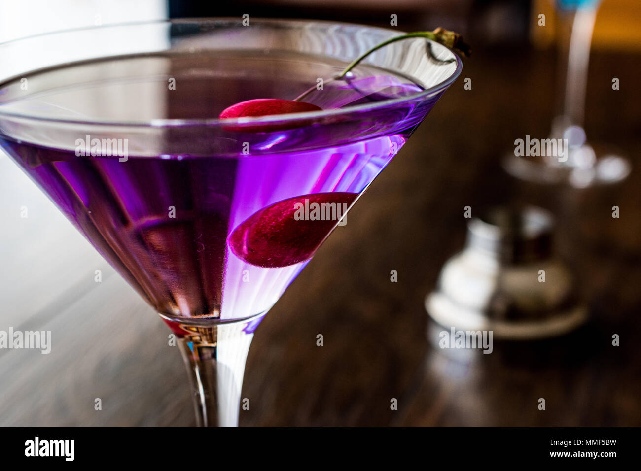 Blue Moon Cocktail with cherry on wooden surface. Luxury Concept Stock ...