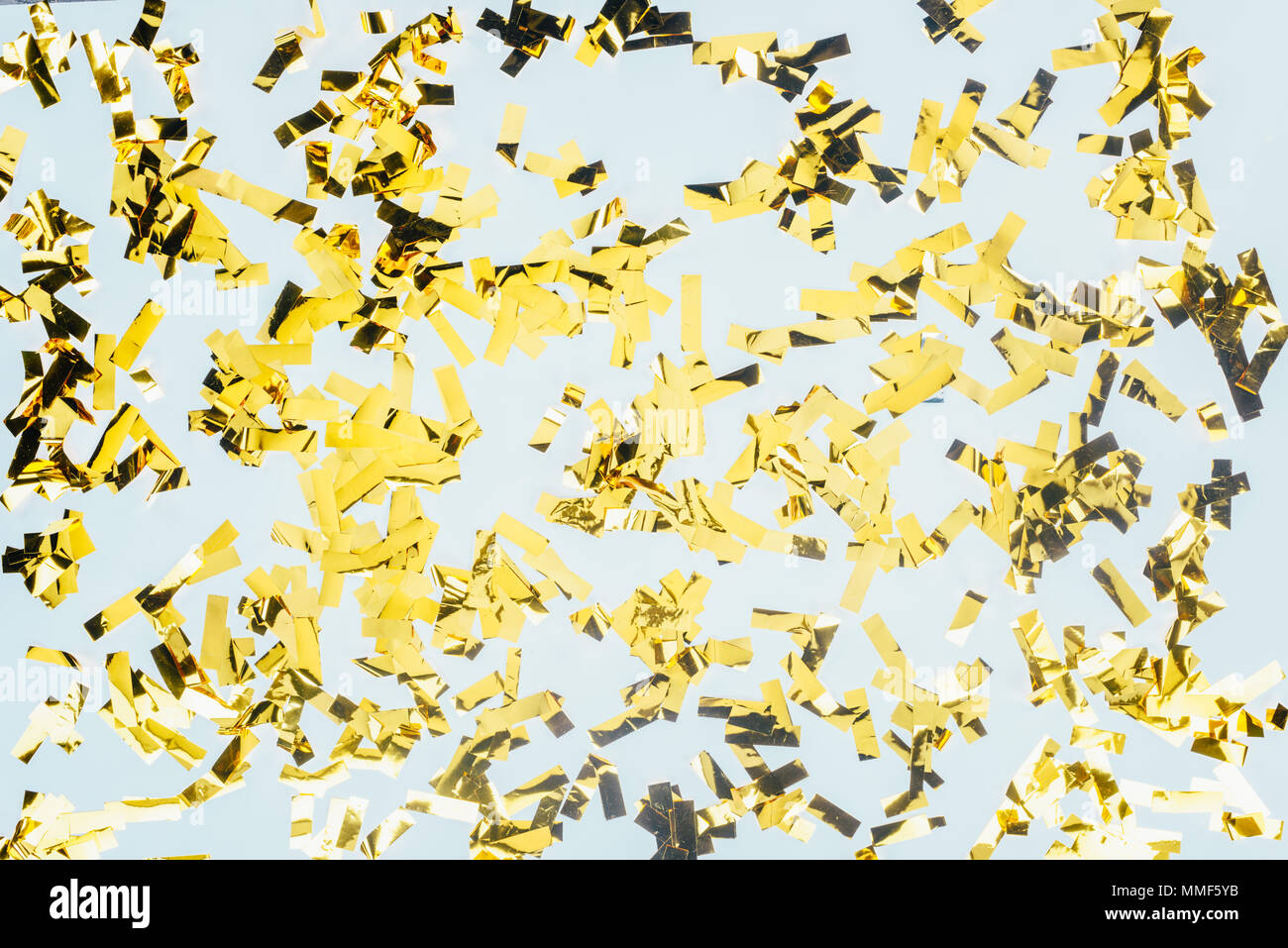 golden glossy confetti Stock Photo - Alamy