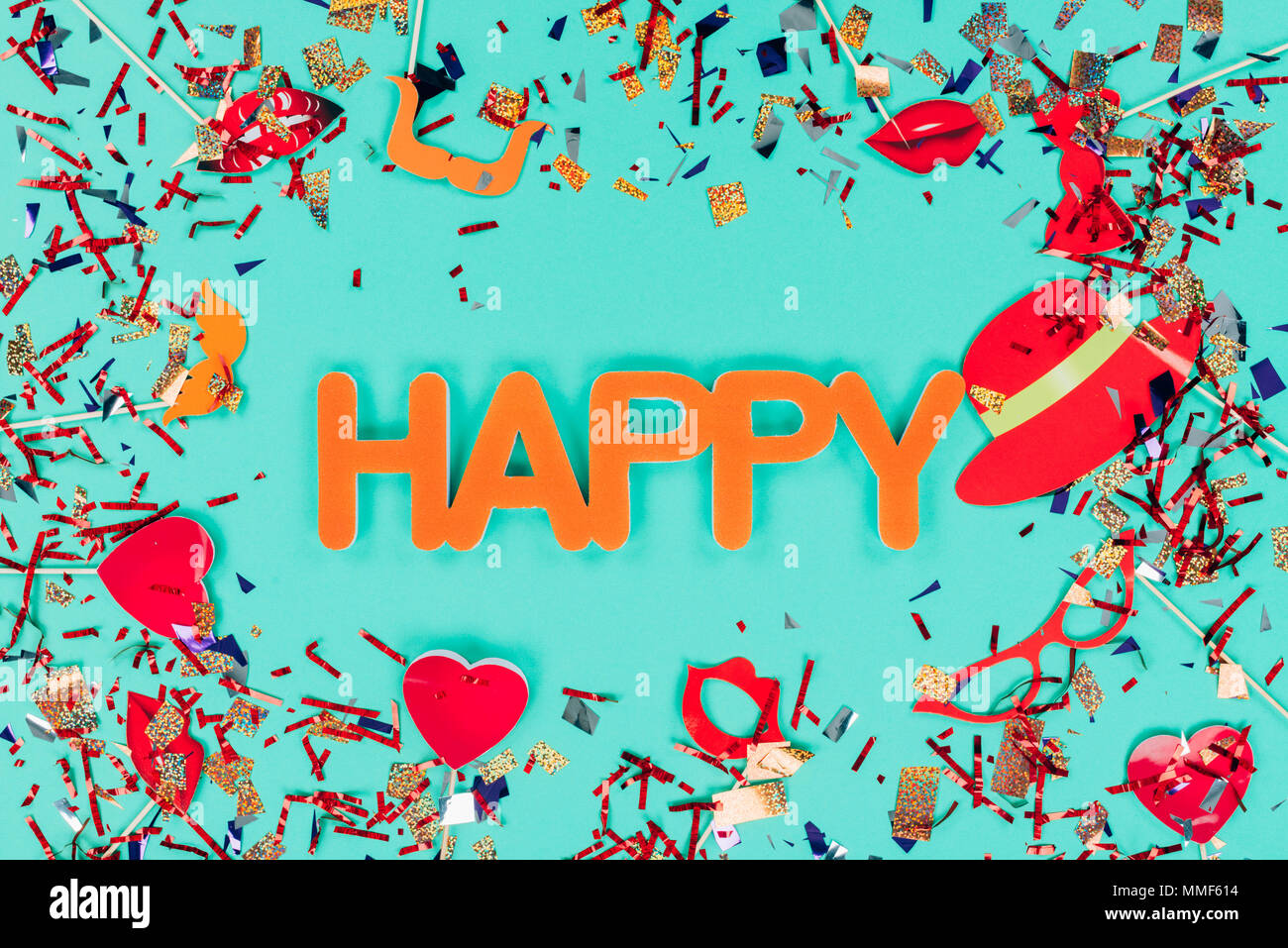 happy sign surrounded with confetti Stock Photo - Alamy