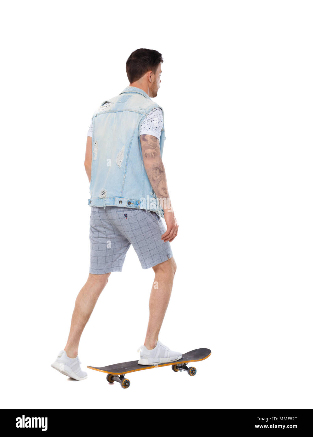 Back view of a man with a skateboard. Rear view people collection ...